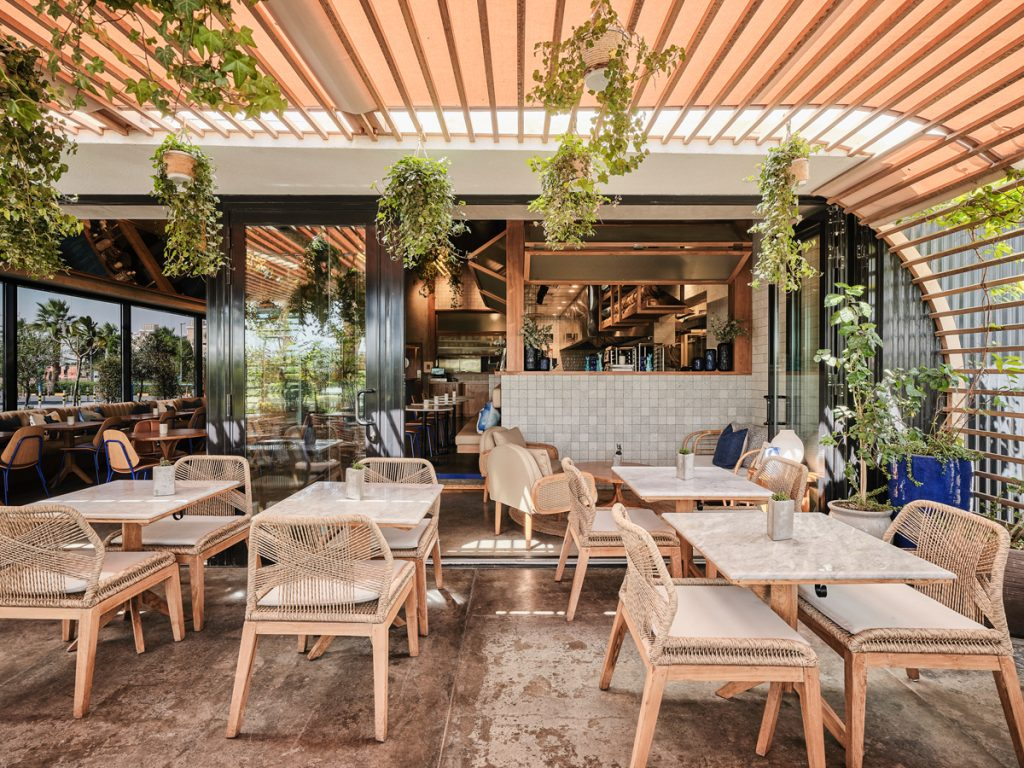 Discover the backyard-inspired Lazy Cat Café by H2R Design: A Brunch Haven - Commercial Design India