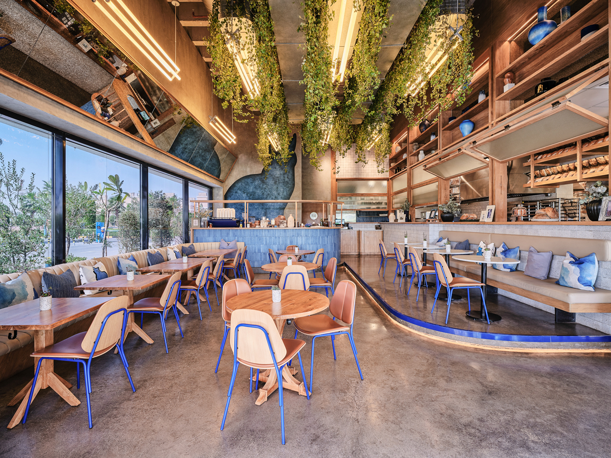 Discover the backyard-inspired Lazy Cat Café by H2R Design: A Brunch Haven - Commercial Design India